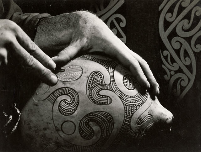 Theo Schoon carving a gourd | Christchurch Art Gallery Te Puna o Waiwhetū